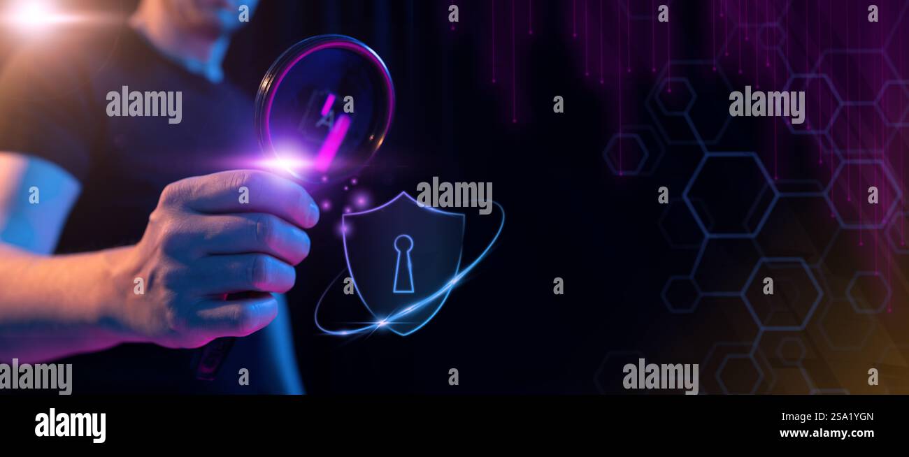 A close-up of a hand holding a magnifying glass reflecting a glowing ...