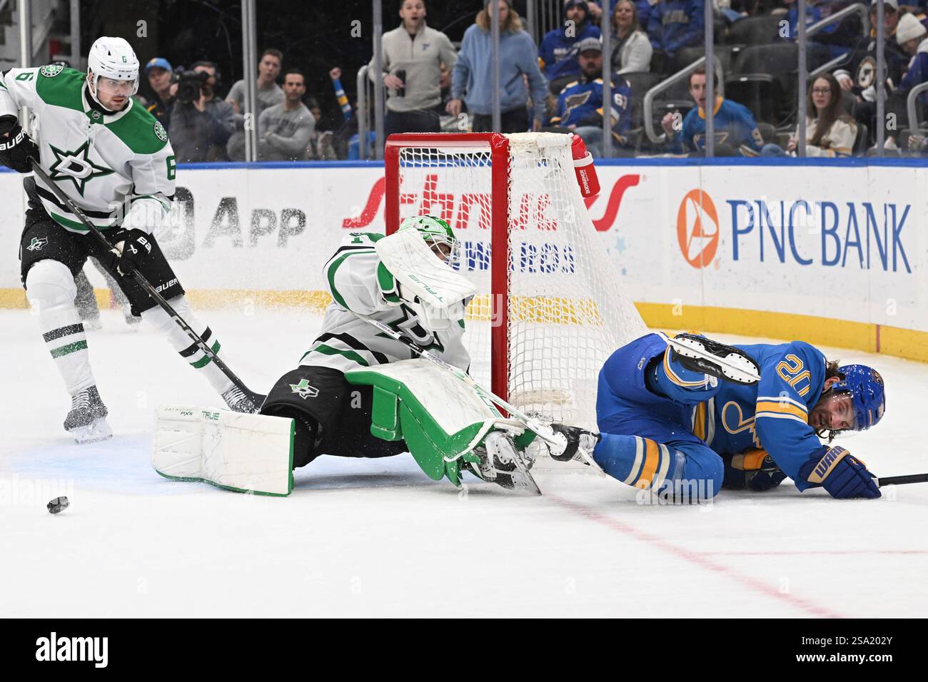 St. Louis Blues' Brandon Saad (20) falls to the ice after colliding ...