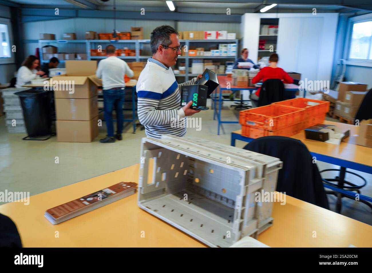 Disabled worker working in the ESAT product packaging workshop ...