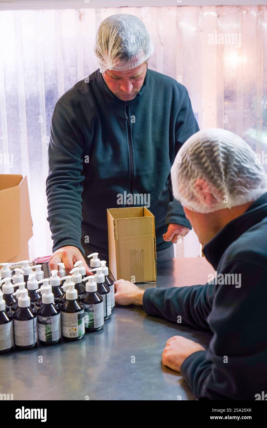 Disabled workers working in the shaping and packaging workshop ...