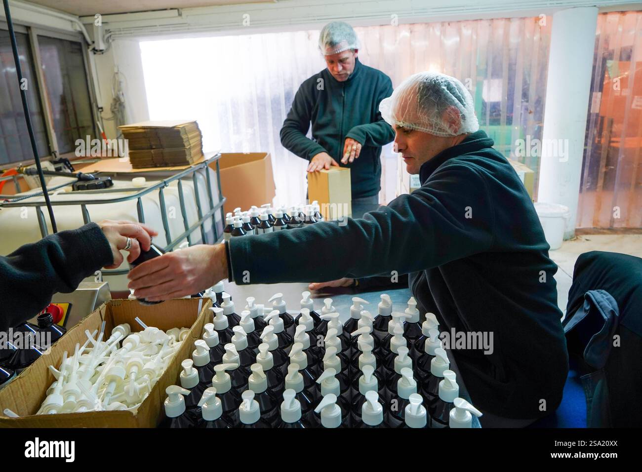 Disabled workers working in the shaping and packaging workshop ...