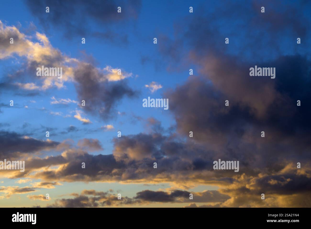 Blue sky with grey and orange clouds at sunrise horizontally Stock ...