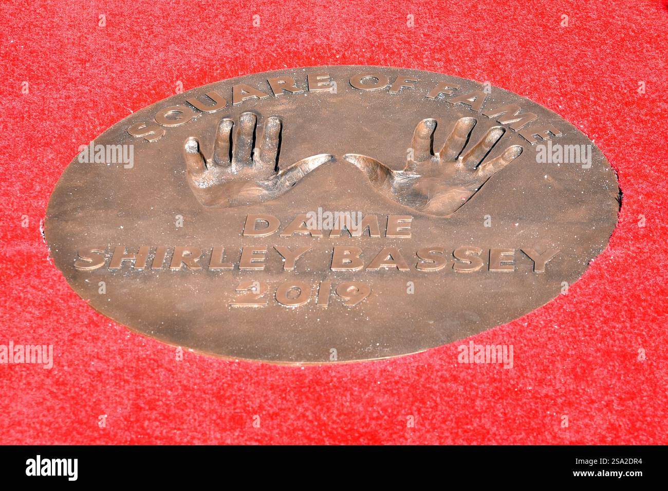 Dame Shirley Bassey unveils her handprints in the form of a bronze ...