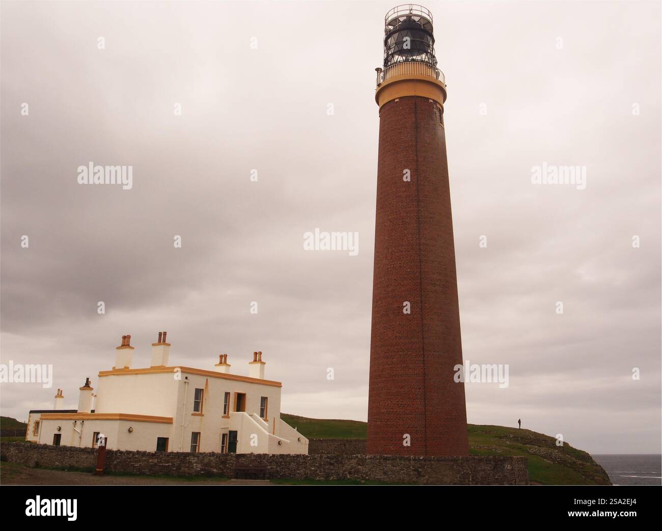 The tall red brick built lighthouse at the Butt of Lewis, the most ...