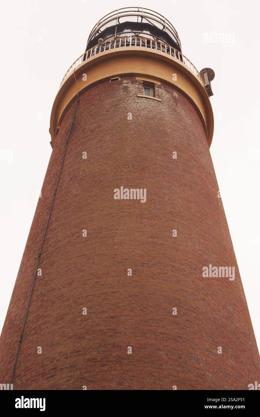 The top half of the tall red brick built lighthouse at the Butt of ...