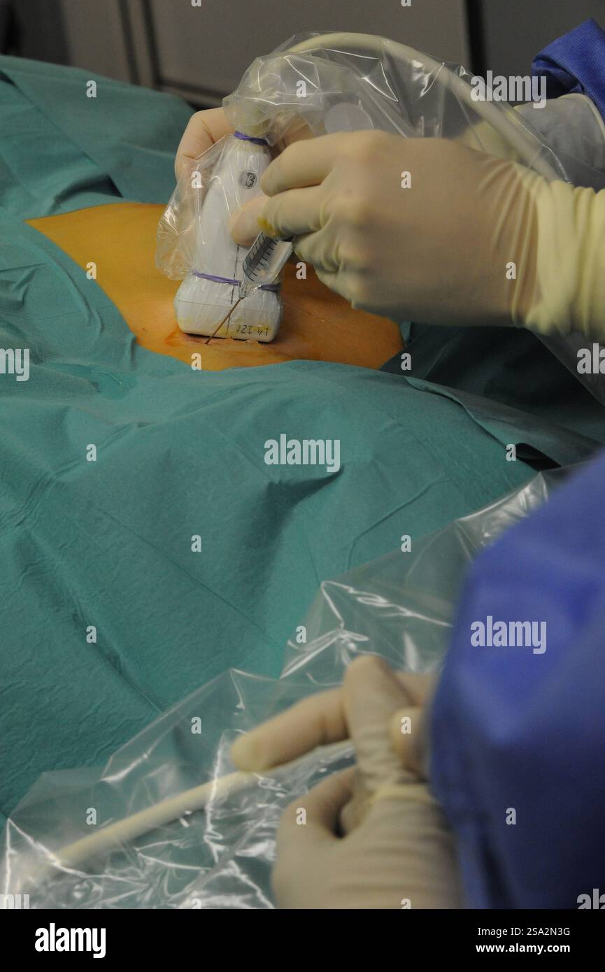 Radiologist performing an ultrasound of an infant Stock Photo - Alamy