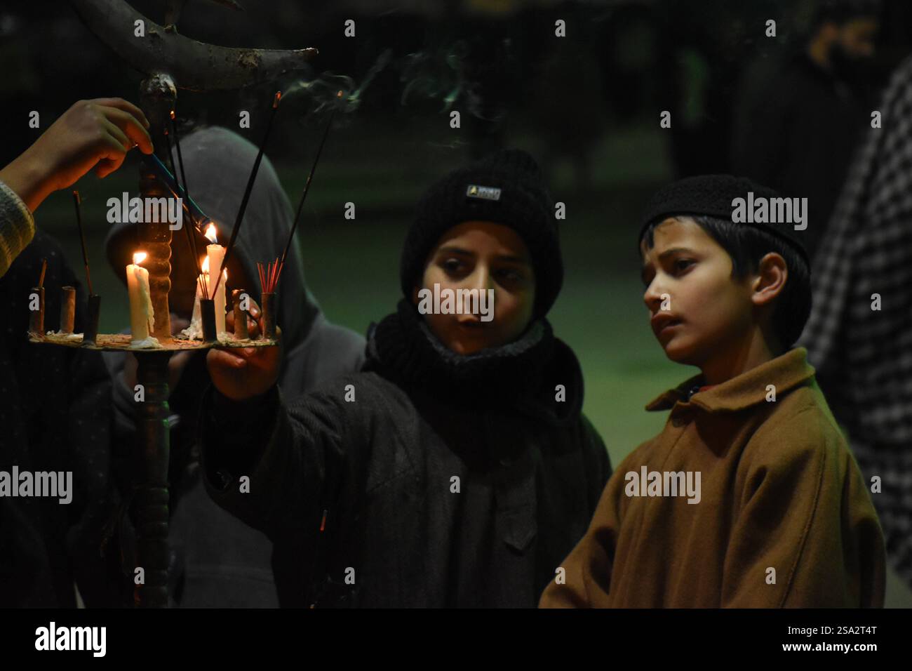 On January 27, 2025, Childrens are seen lighting incense sticks and ...