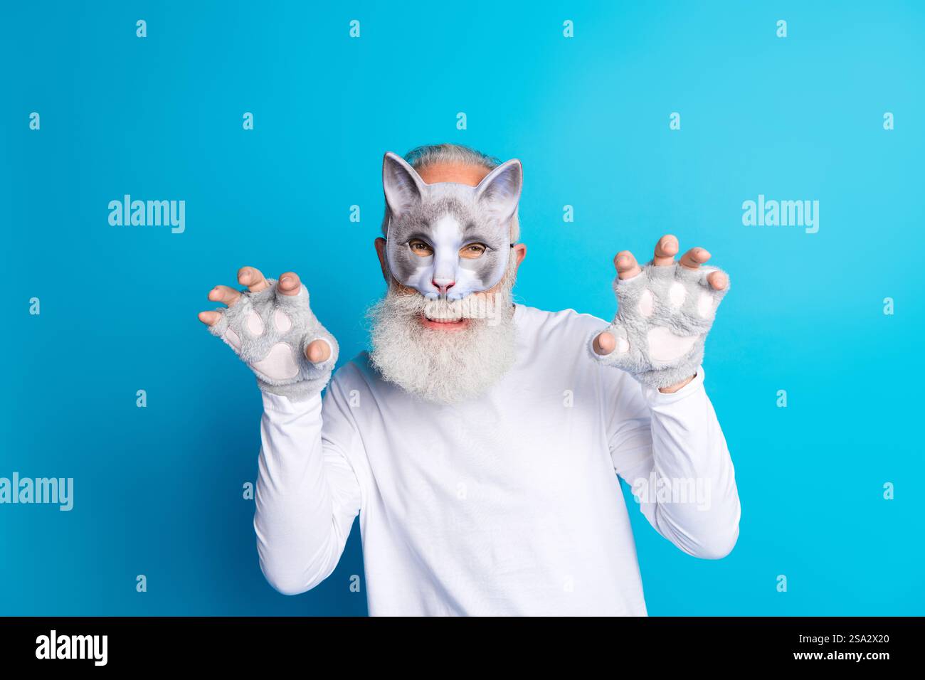 Elderly man in cat-themed costume against a blue background showcasing ...