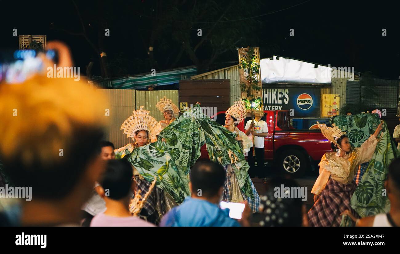 Students in vibrant costumes join the lively Dinagyang Festival parade ...