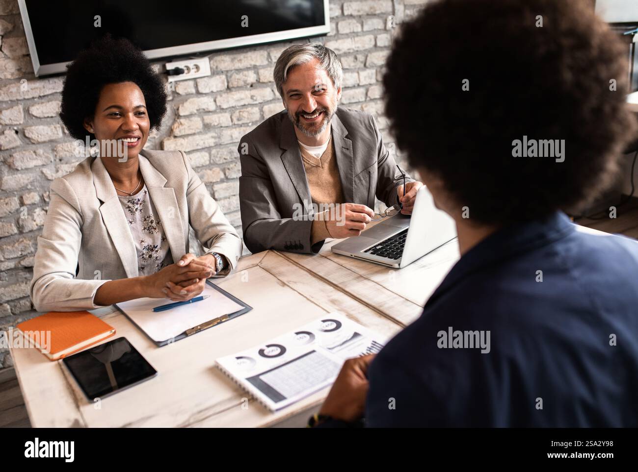 Business recruiters talking with candidate during job interview Stock ...