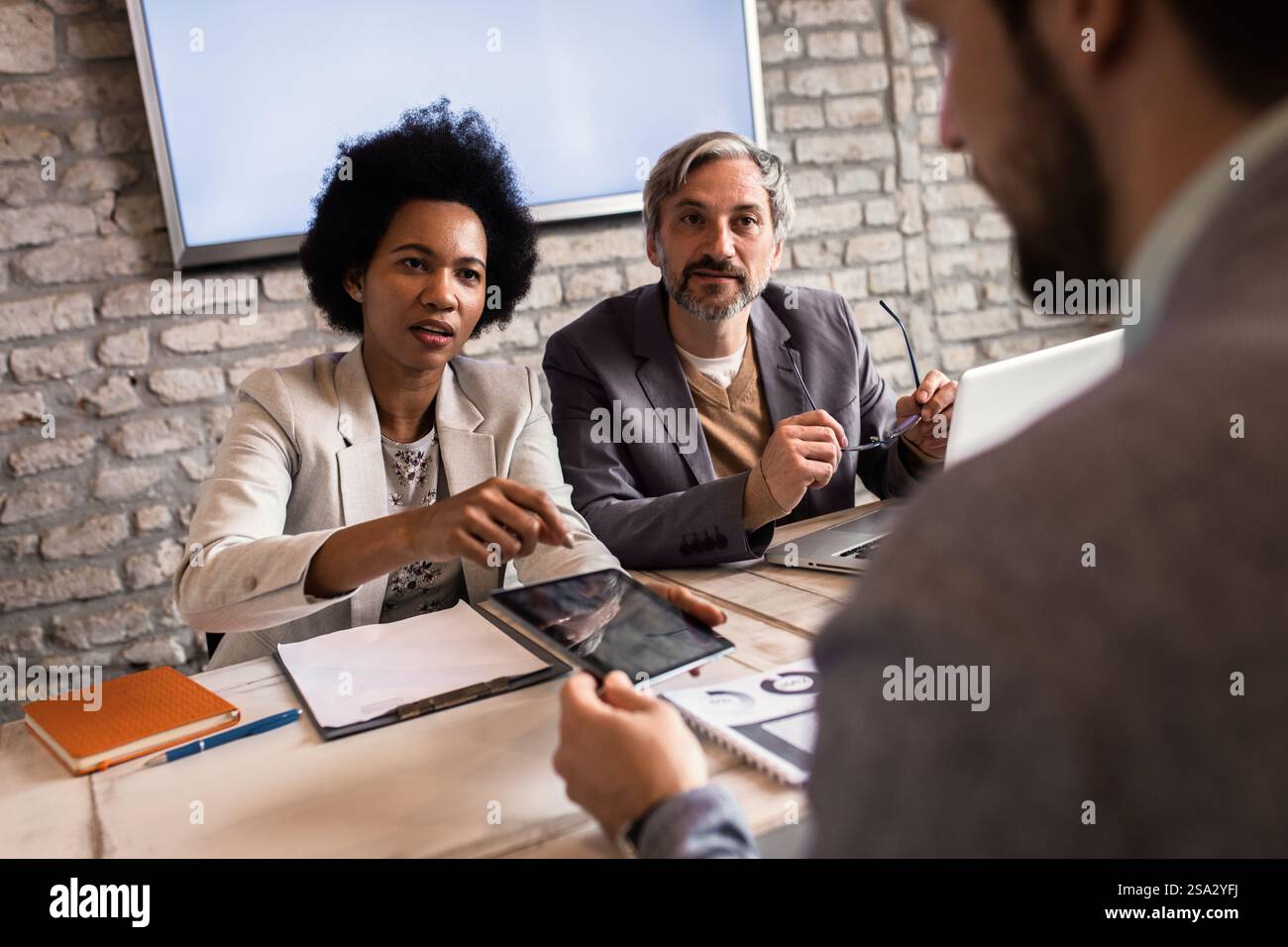 Business recruiters talking with candidate during job interview Stock ...