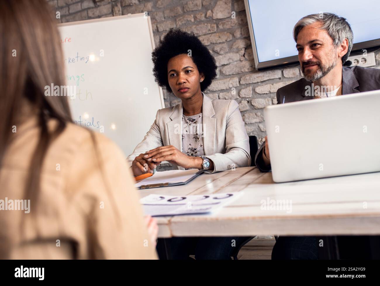 Business recruiters talking with candidate during job interview Stock ...