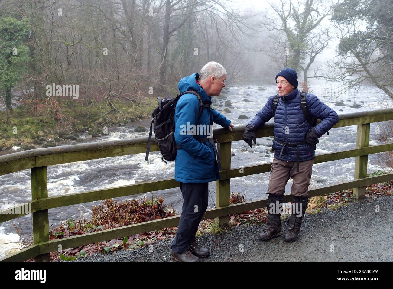 Two Elderly Men (Hikers) Stood Talking by Wooden Fence by the River ...