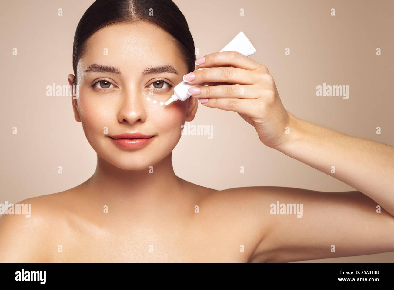 Beautiful woman using cream around the eyes. Video of woman with ...