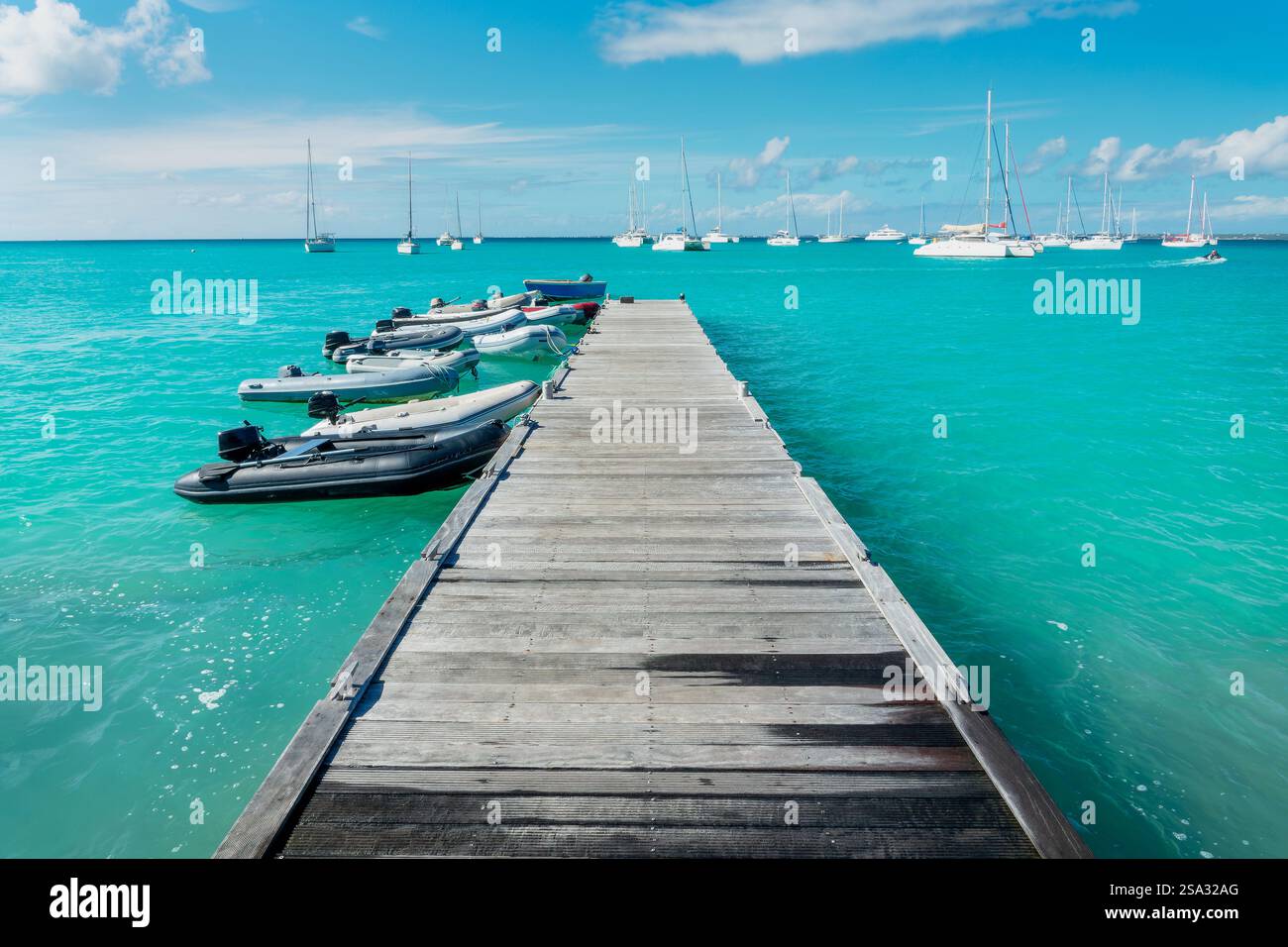 Old wooden pier on the beach of Grand Case, on the French side of the ...