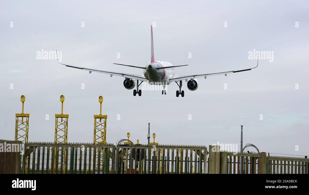 Under the Wings: A Glimpse of the Landing Approach Stock Photo - Alamy
