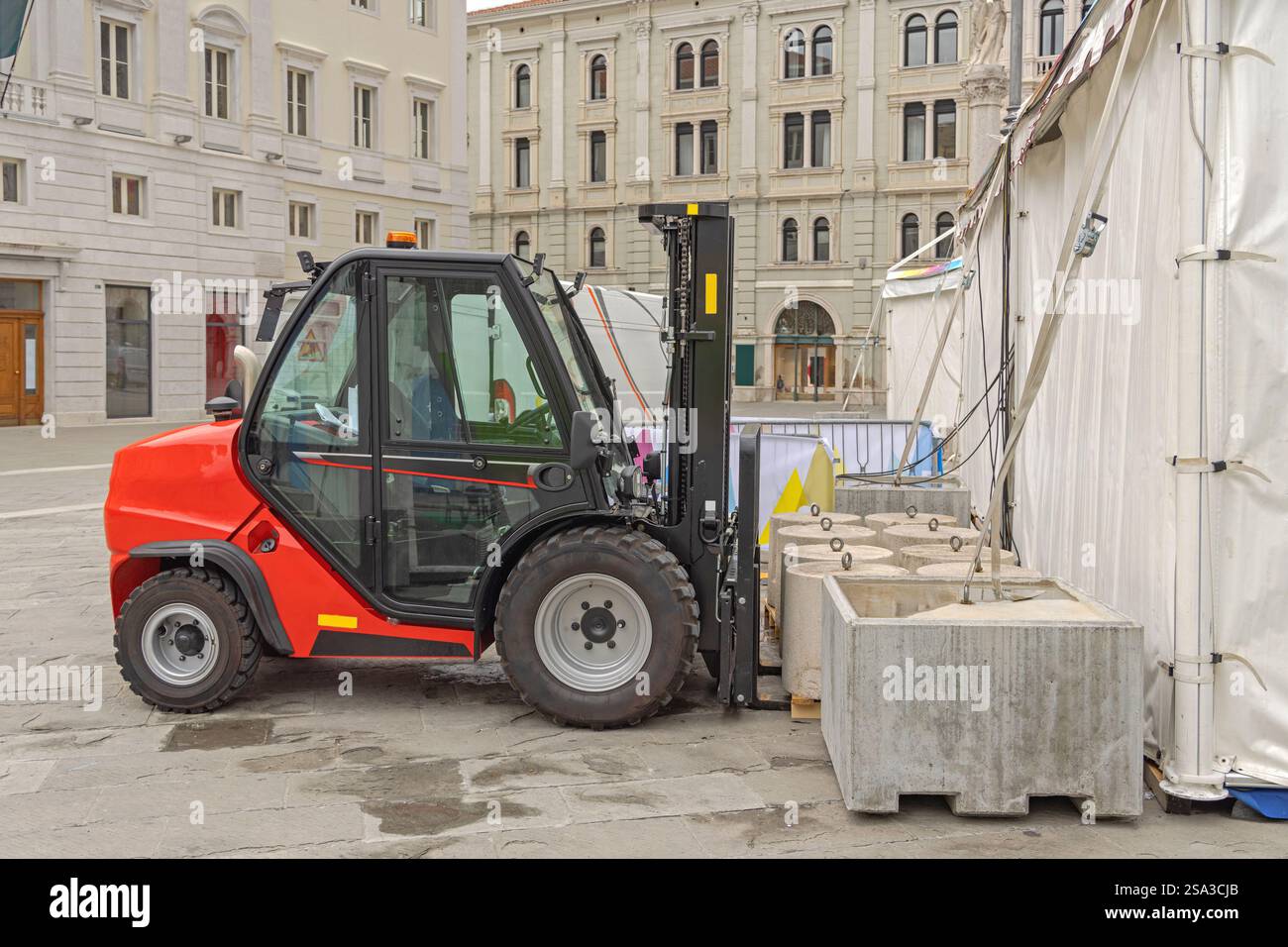 Red Forklift Truck Lifting Concrete Weights for Pop Up Canopy Tent at ...