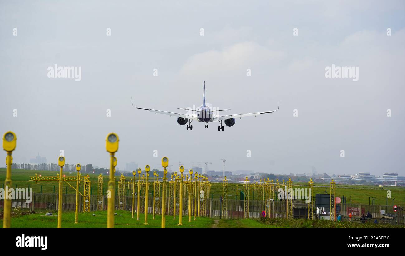Under the Wings: A Glimpse of the Landing Approach Stock Photo - Alamy