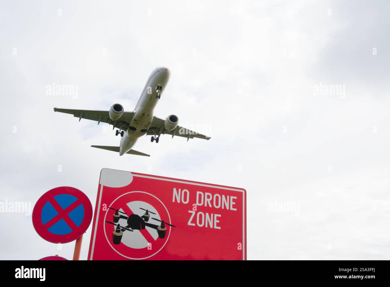 High-Flying Contradiction: Plane Passes Over 'No Drone Zone' Sign Stock ...