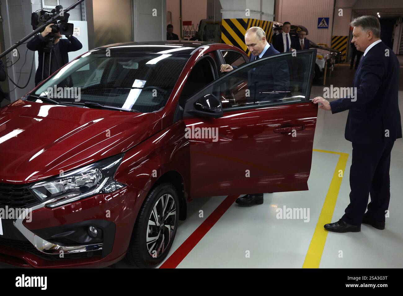 Russian President Vladimir Putin inspects a new Lada Iskra car during a ...