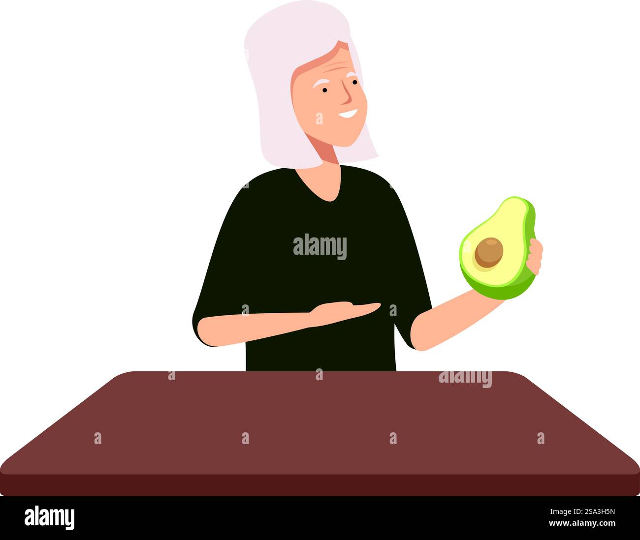 Cheerful senior woman holding a ripe avocado, standing by a kitchen ...