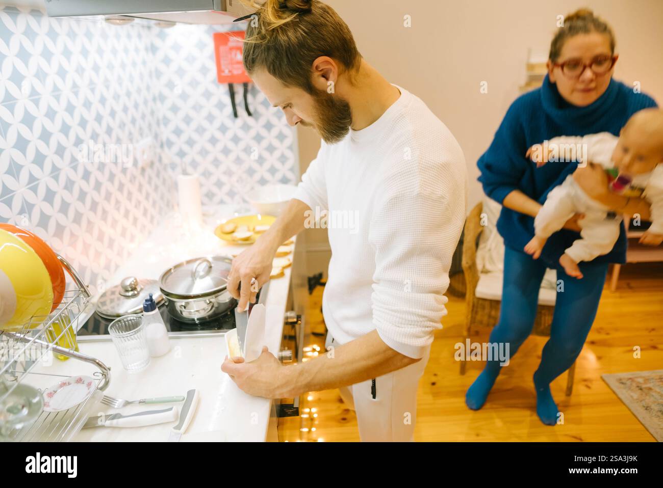 Enjoying Family Cooking Time with a Baby in the Kitchen, Creating ...