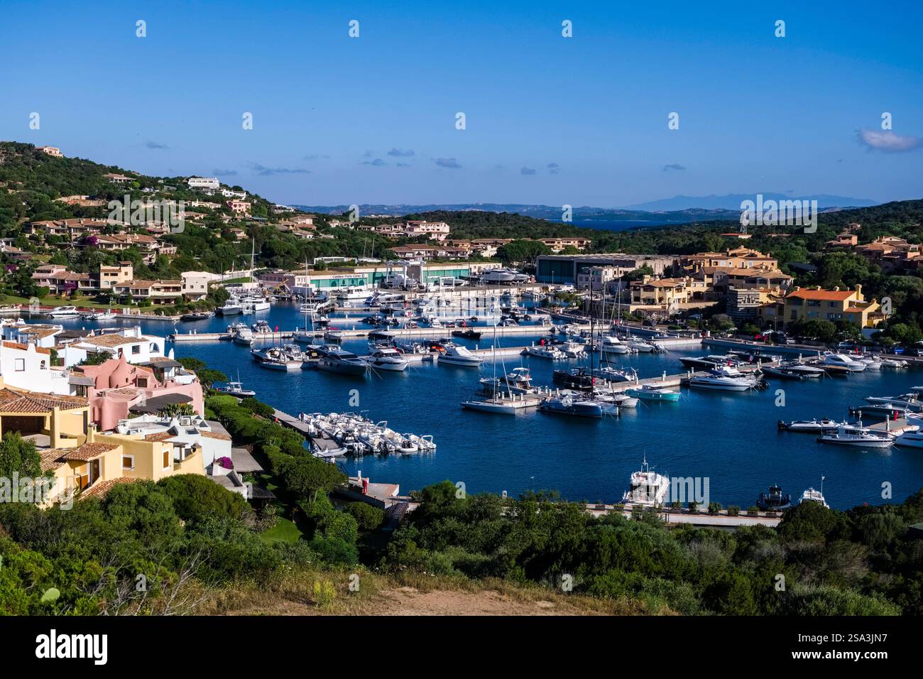 Aerial view of the houses, harbour and marina of the coastal town of ...