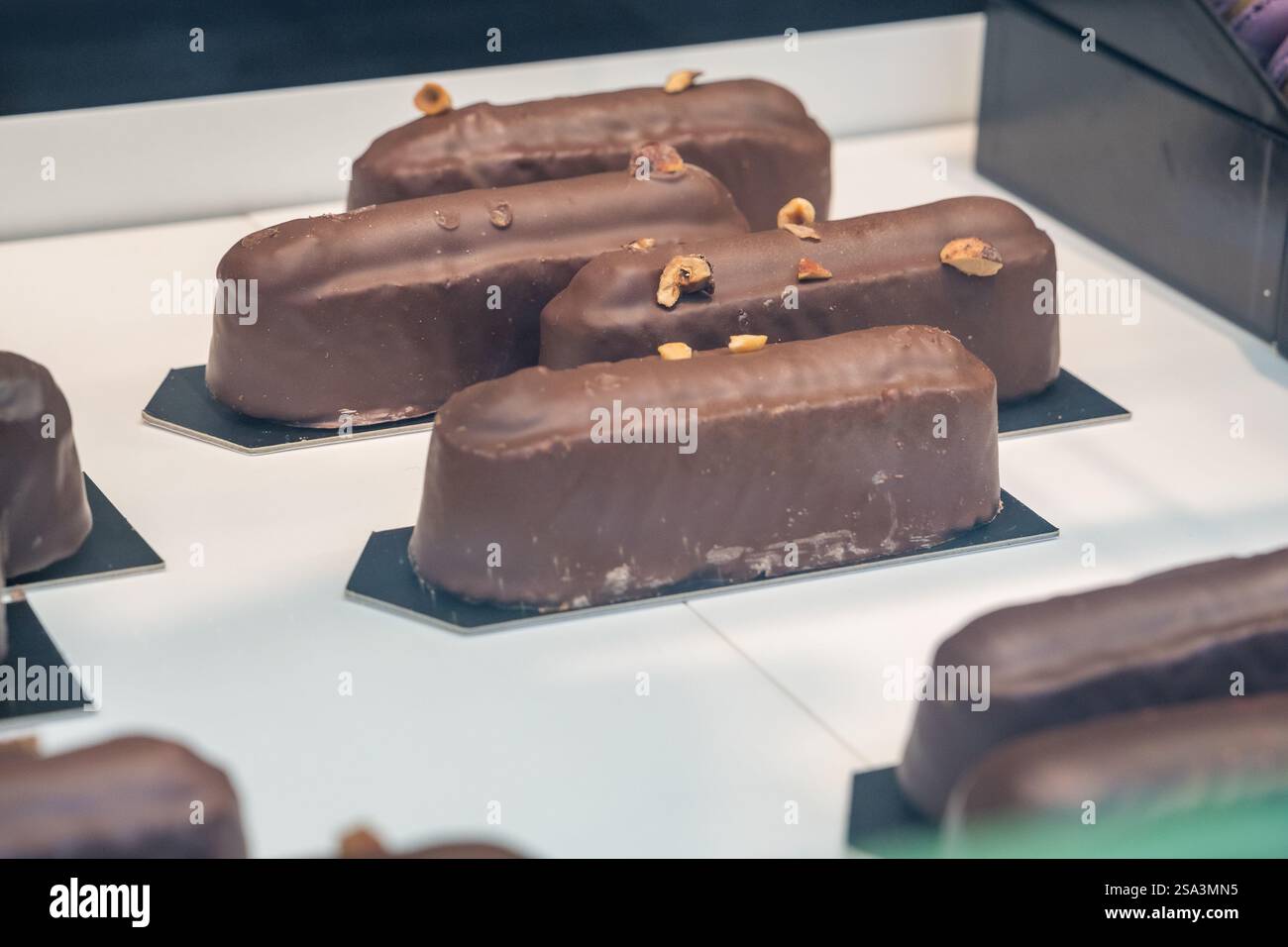 Delightful chocolate treats displayed in a modern candy shop Stock ...