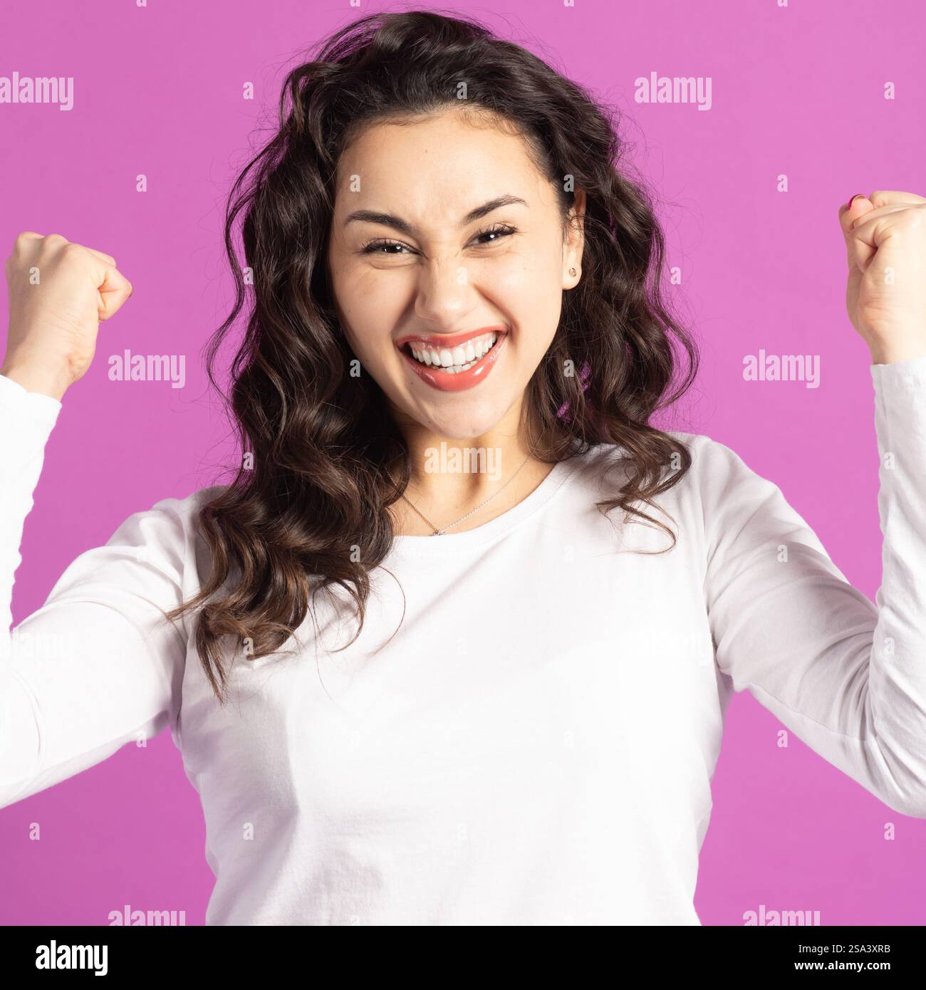 Lifestyle concept. Excited woman portrait with raised hands and ...