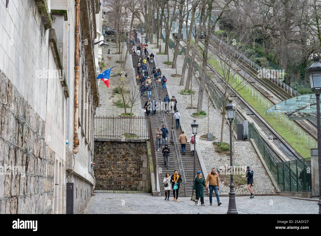 Crowded steps lead to charming neighborhood in springtime afternoon ...