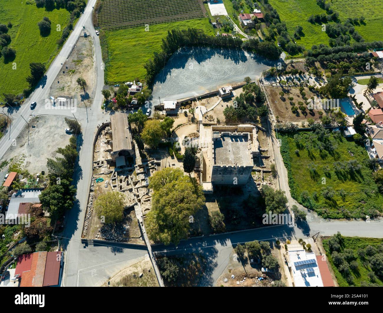 Aerial view of Kolossi Castle, a medieval fortress surrounded by lush ...