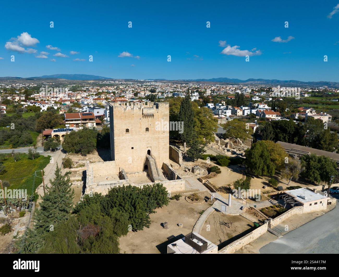 Aerial view of Kolossi Castle, a medieval fortress surrounded by lush ...