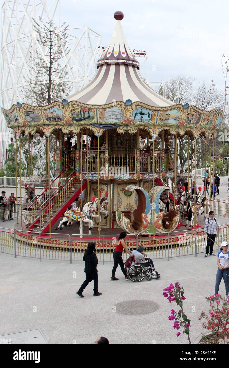 Mexico City, Mexico - Mar 20 2024: Two-story carousel with moving rides ...