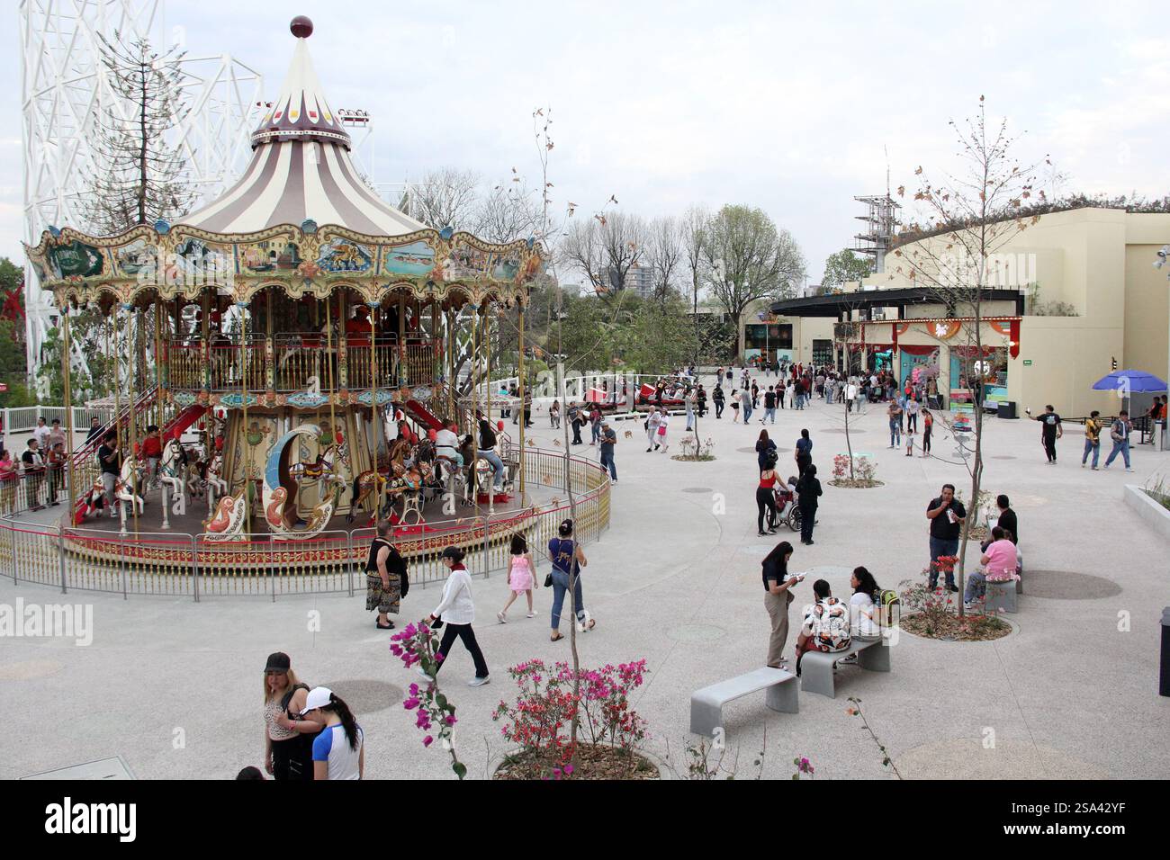 Mexico City, Mexico - Mar 20 2024: Two-story carousel with moving rides ...