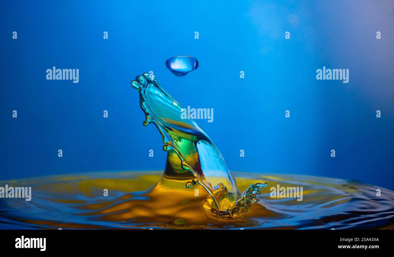 Arresting, ethereal, colour infused, imaginative water collision, macro ...