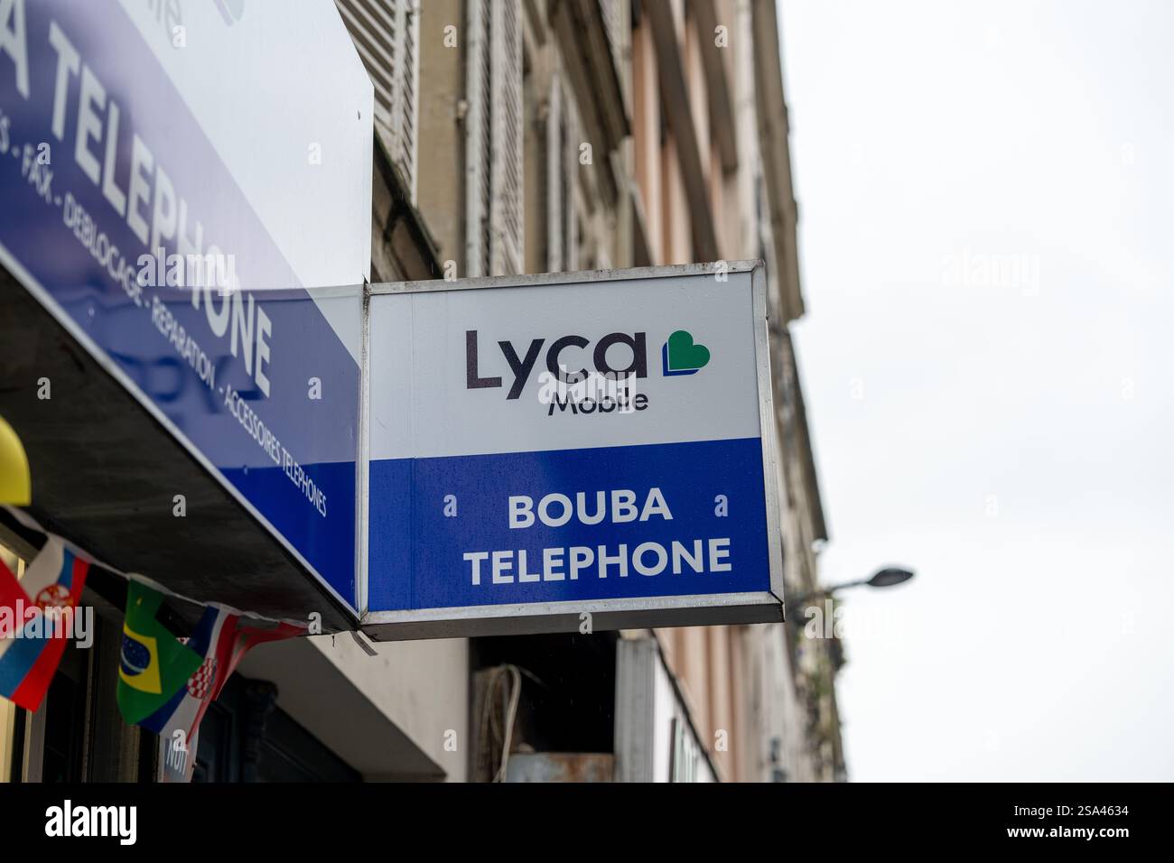Brightly colored signage invites passersby to use cellphone services ...