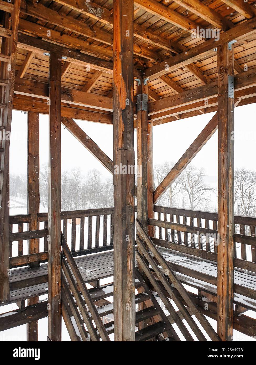 Inside wooden watch tower in countryside. Under the roof of tall wooden ...