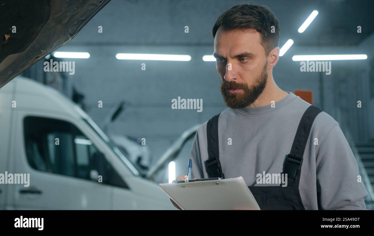 Auto mechanic professional technical expert Caucasian man male checking ...