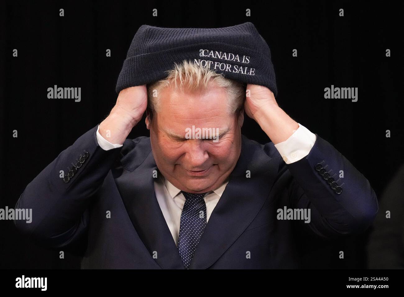 Toronto, Canada. 28th Jan, 2025. Ontario Premier Doug Ford dons a toque ...