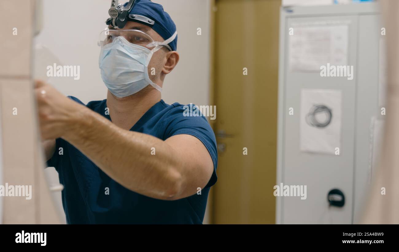 Doctor man surgeon male physician in uniform washing hands in hospital ...