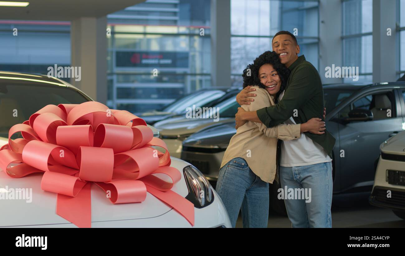 African American couple boyfriend girlfriend in dealership showroom ...