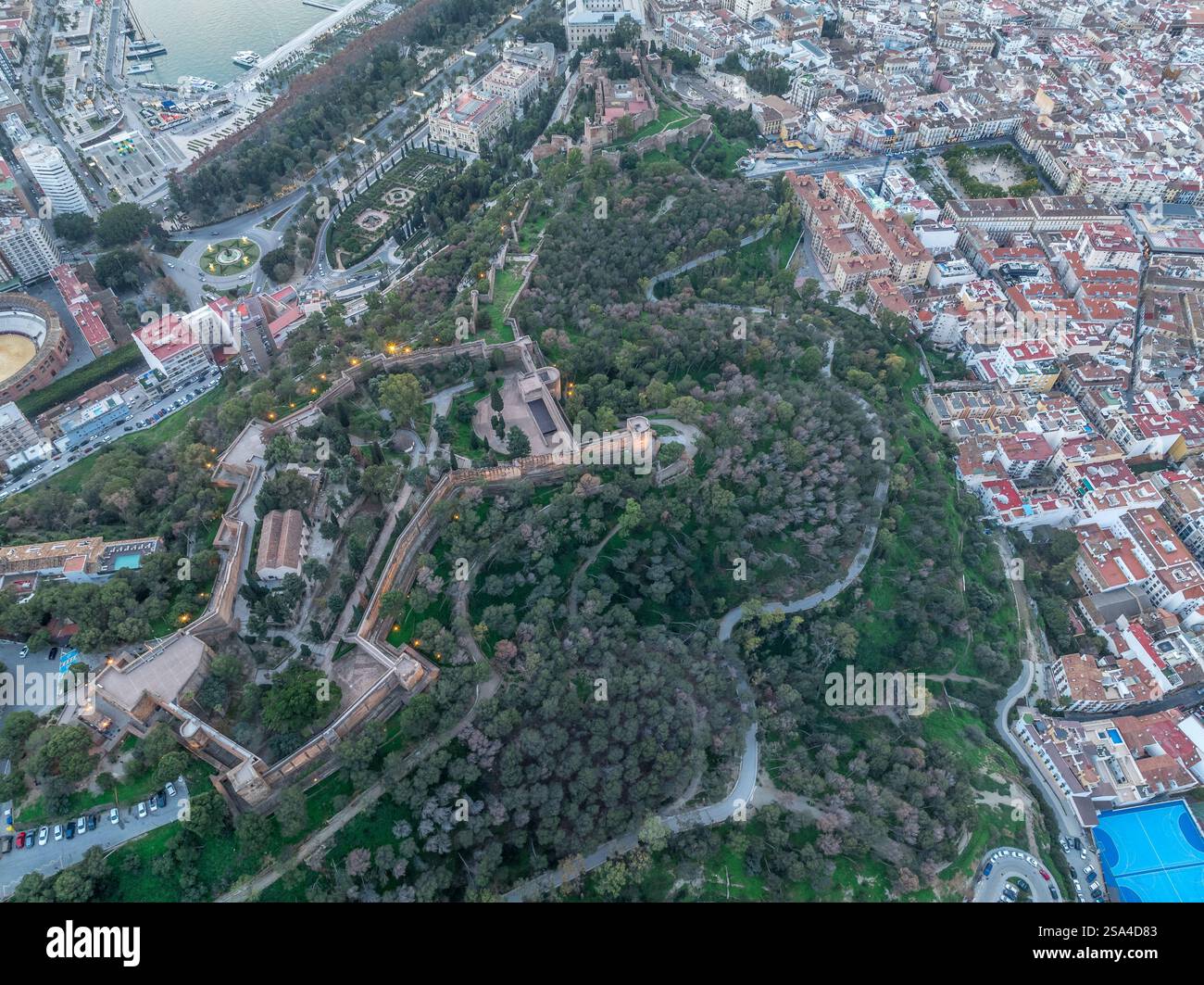Aerial view of Malaga Alcazaba and Gibralfaro castle, crenellated wall ...