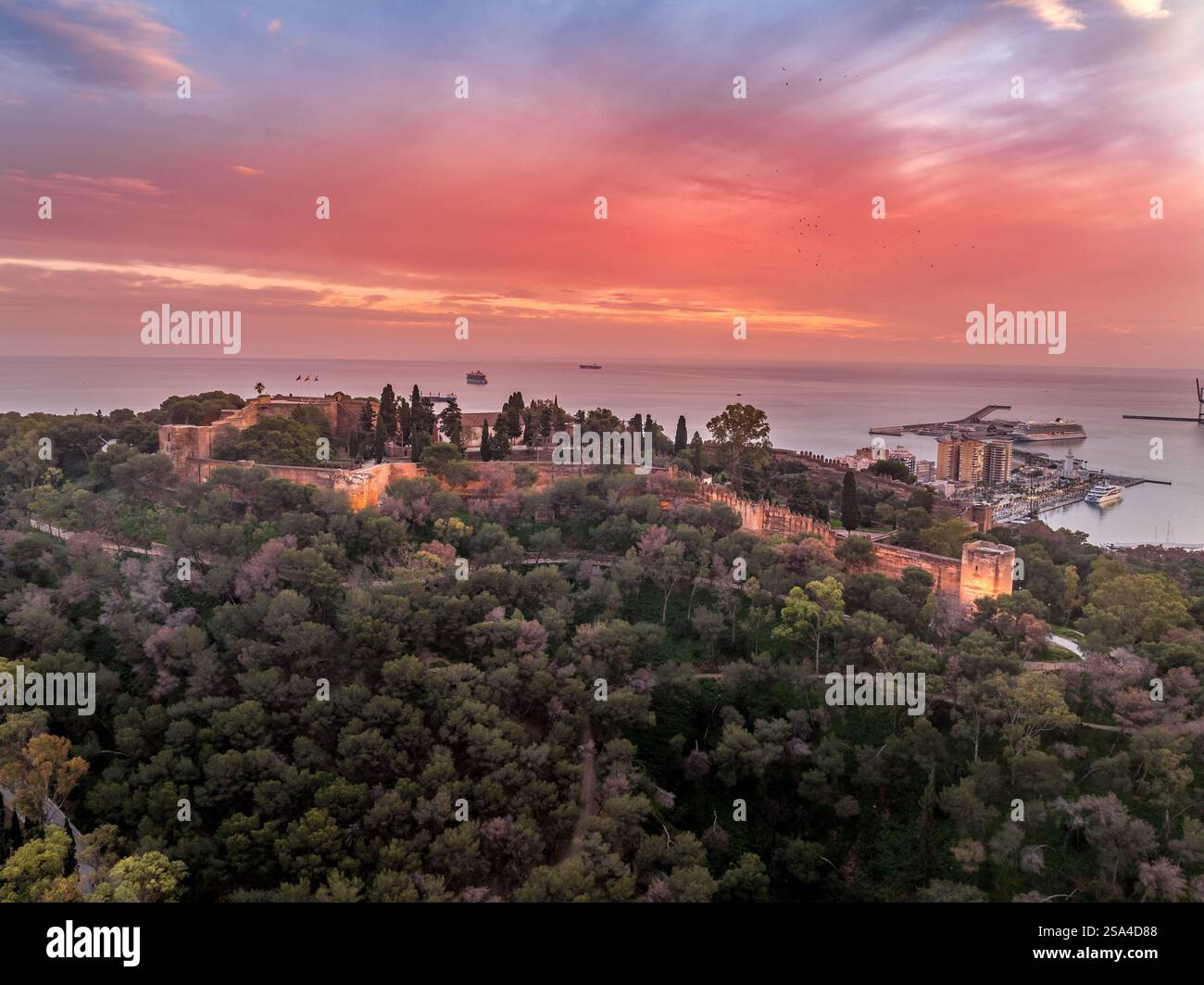 Aerial sunset view of Gibralfaro castle in Malaga Spain with colorful ...