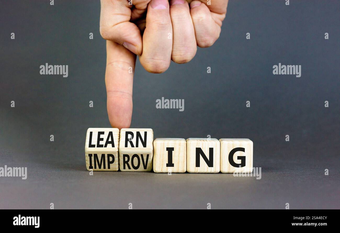 Improving or learning symbol. Businessman turns wooden cubes and ...