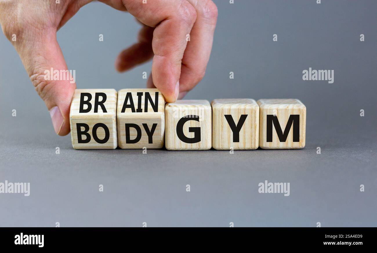 Body vs brain gym symbol. Businessman turns wooden cubes and changes ...