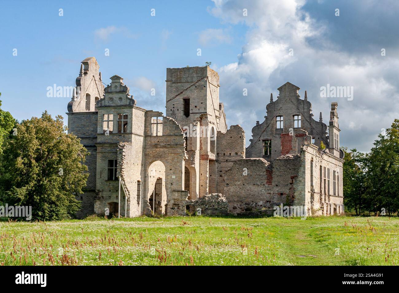 A scenic view of an ancient stone castle in ruins, surrounded by ...