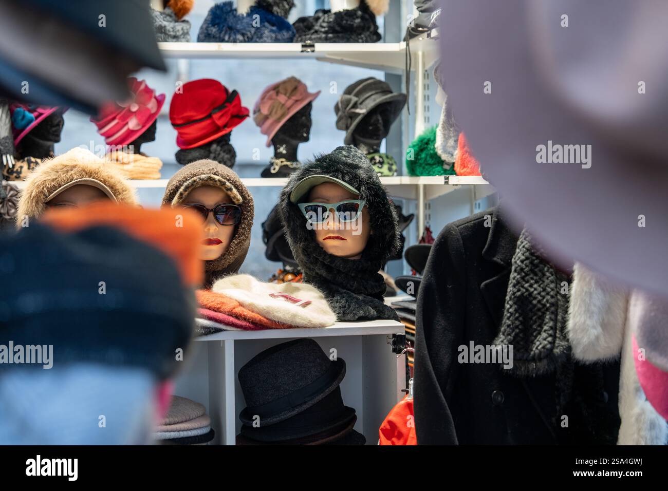 Stylish hats and playful mannequins showcase a vibrant hat shop Stock ...
