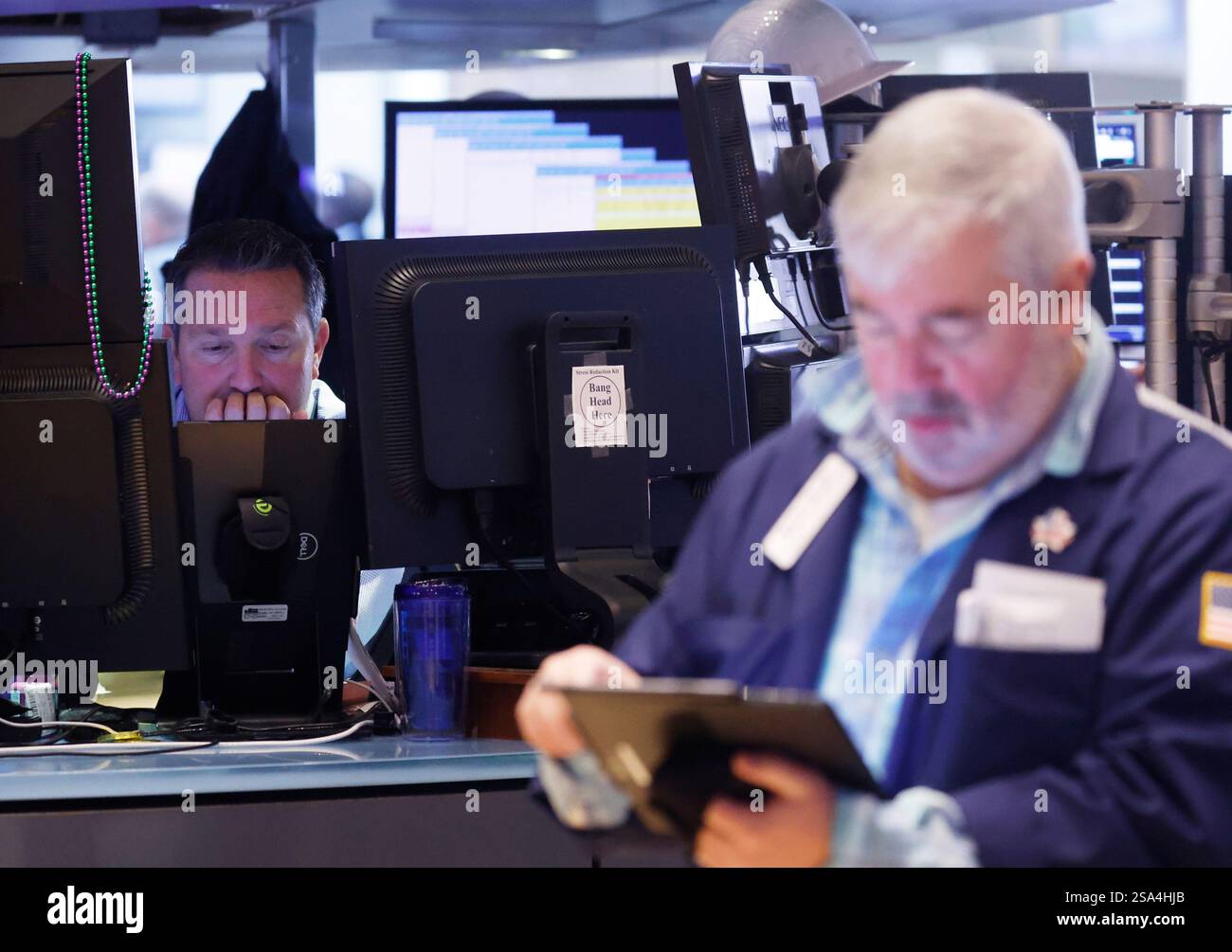 New York, United States. 28th Jan, 2025. Traders work on the floor of ...