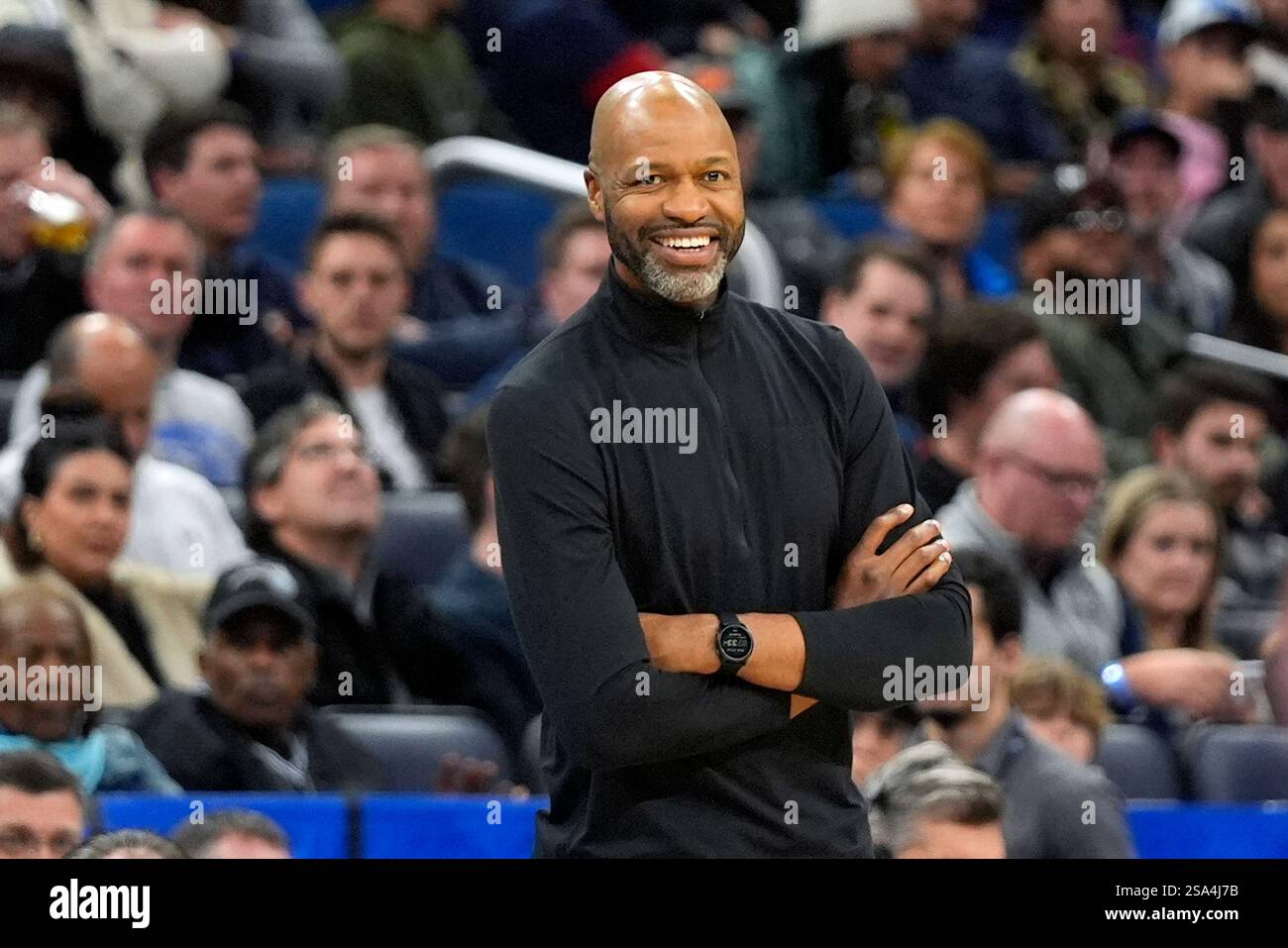 Orlando Magic head coach Jamahl Mosley smiles after a play against the ...