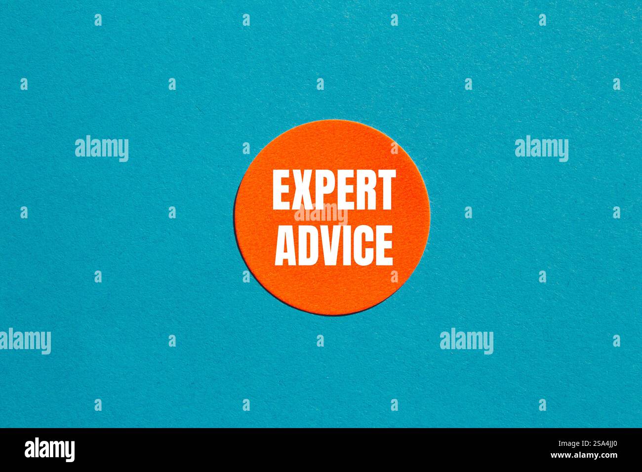 Expert advice message written on round orange sticker with blue ...